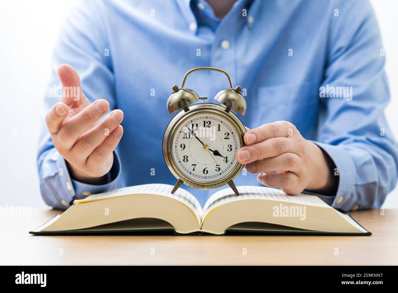 Businessman Reading Clock Stock Photo - Alamy