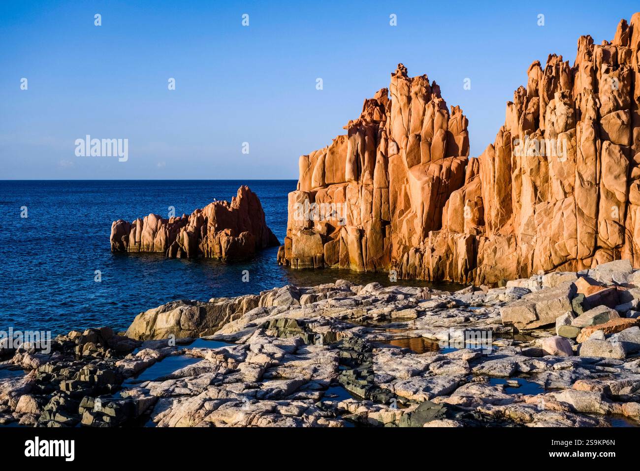 The blood-red porphyry peaks of Arbatax, Rocce Rosse, which rise out of ...