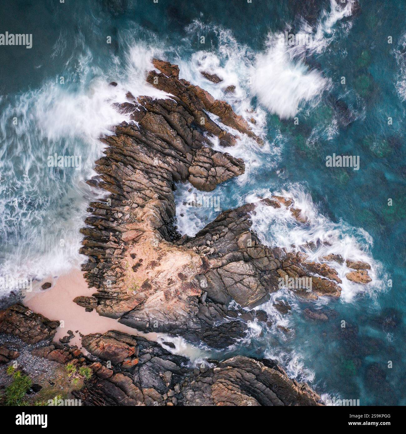 C letter looking rock at the coast of Australia Stock Photo - Alamy