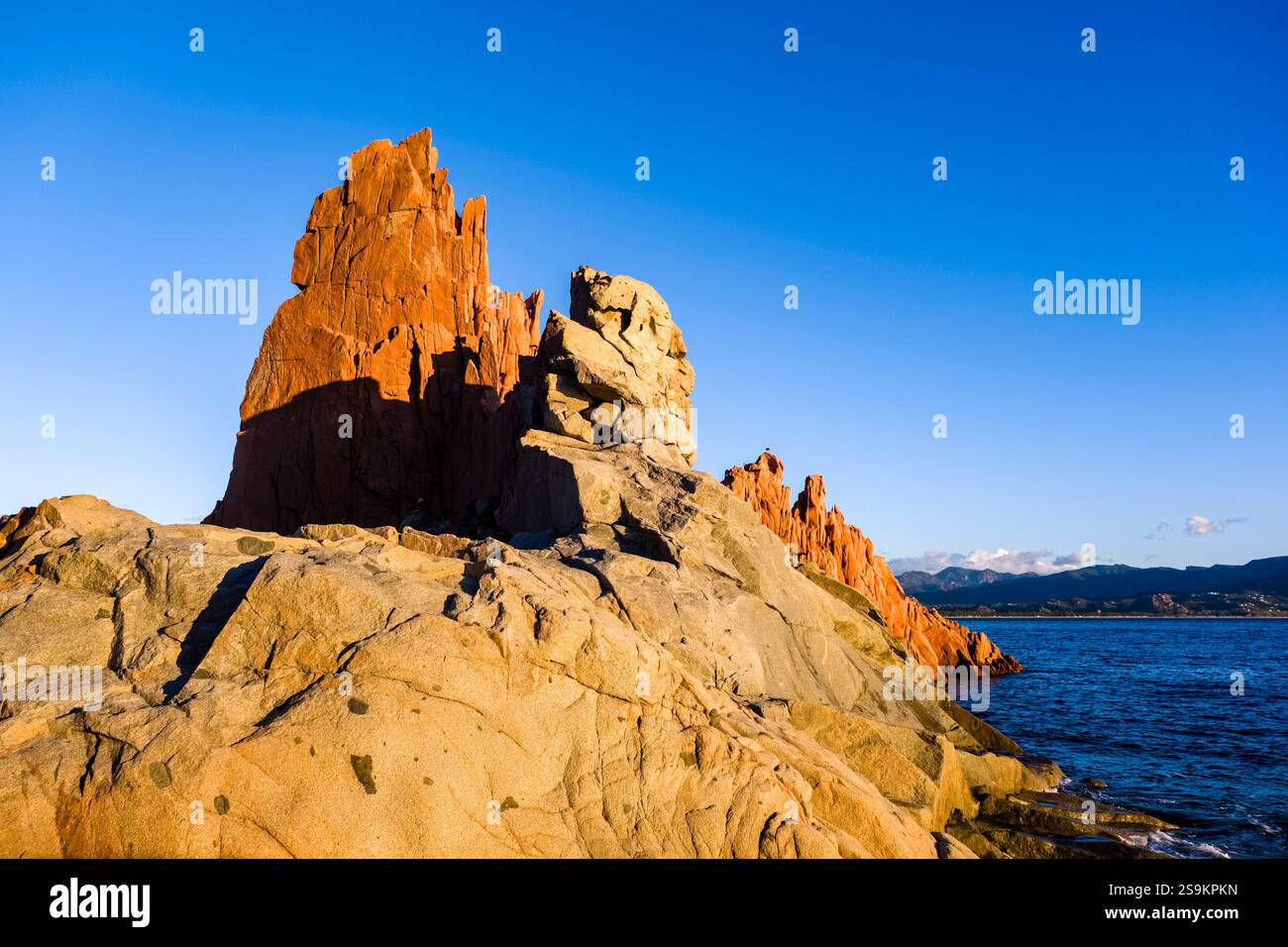 The blood-red porphyry peaks of Arbatax, Rocce Rosse, which rise out of ...