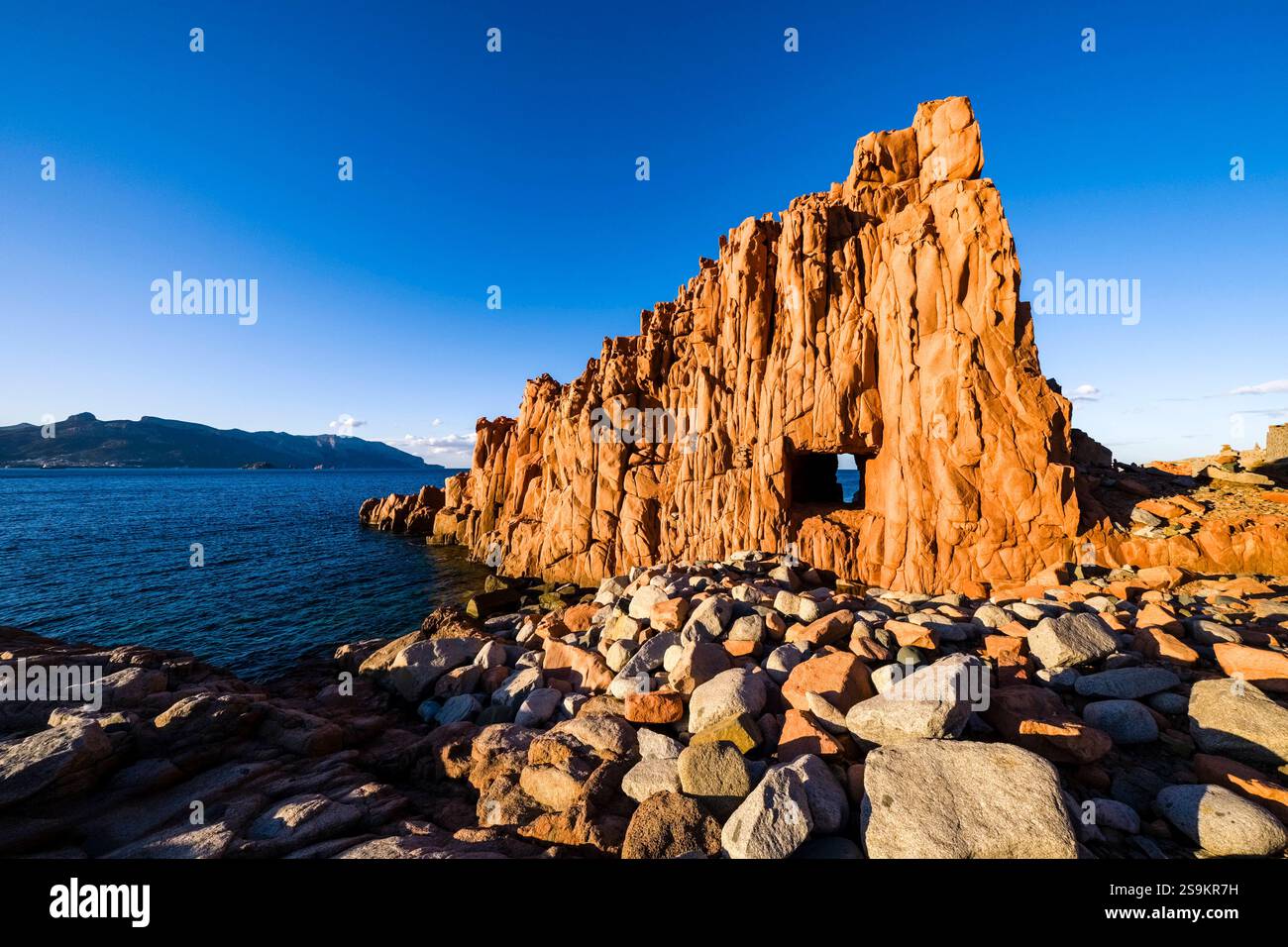 The blood-red porphyry peaks of Arbatax, Rocce Rosse, which rise out of ...
