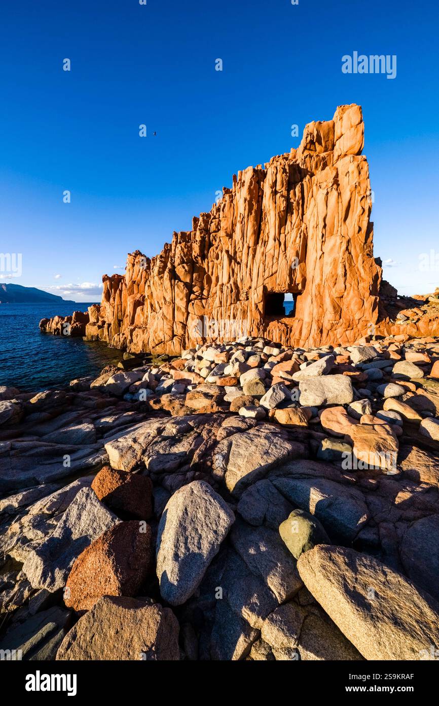 The blood-red porphyry peaks of Arbatax, Rocce Rosse, which rise out of ...
