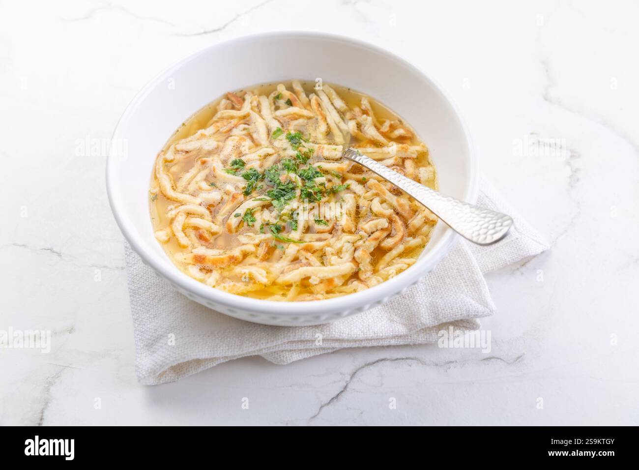 Pancake soup - traditional German chicken broth with pancake noodles ...