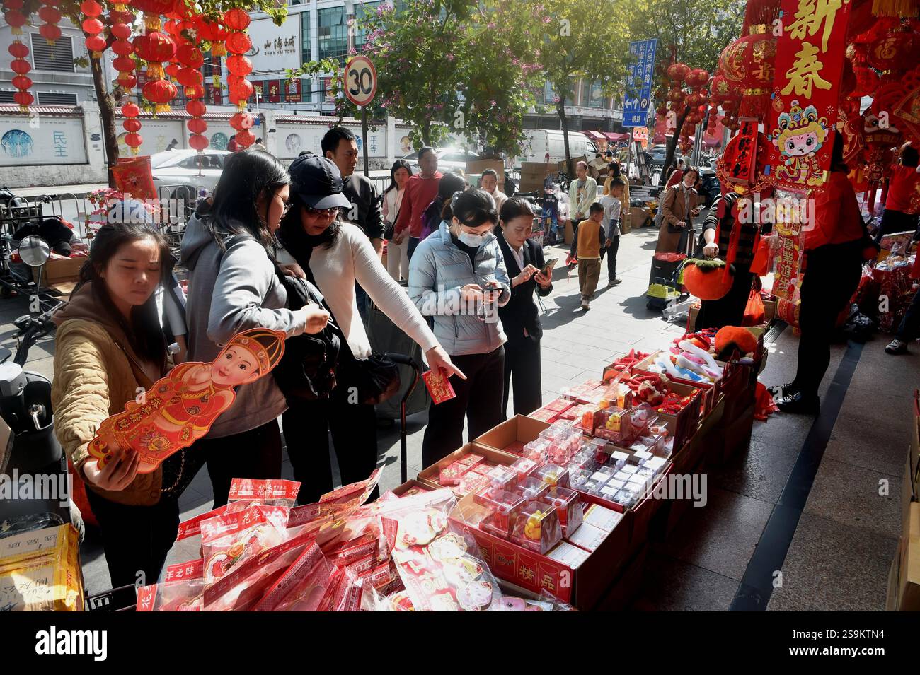 People select Spring Festival decorations in Guangzhou City, south ...