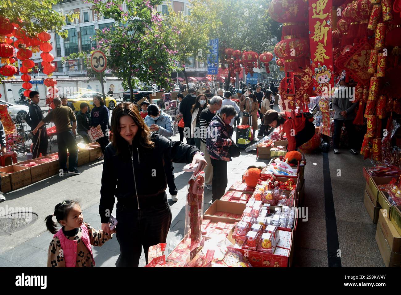 People select Spring Festival decorations in Guangzhou City, south ...