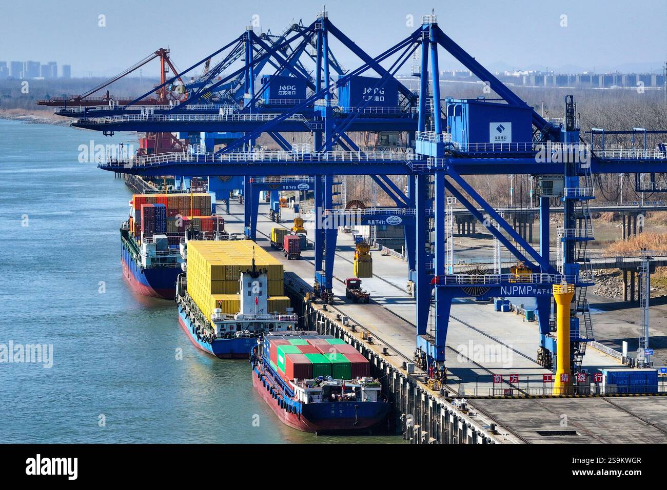 NANJING, CHINA - JANUARY 27, 2025 - Cargo ships dock at the Qiba Port ...