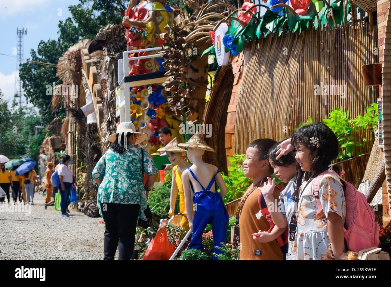 Giant Scarecrows of the Bambanti Festival Visitors observe giant ...