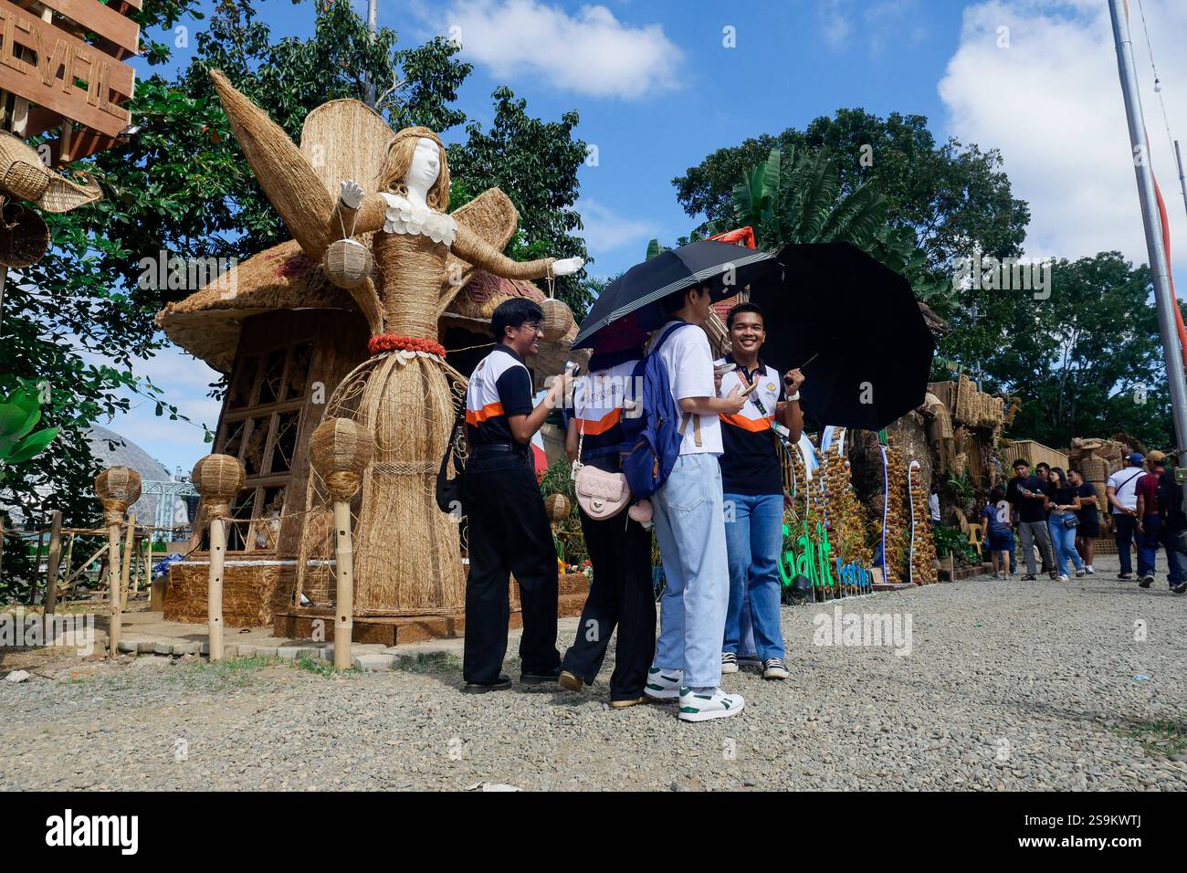 Giant Scarecrows of the Bambanti Festival Visitors observe giant ...
