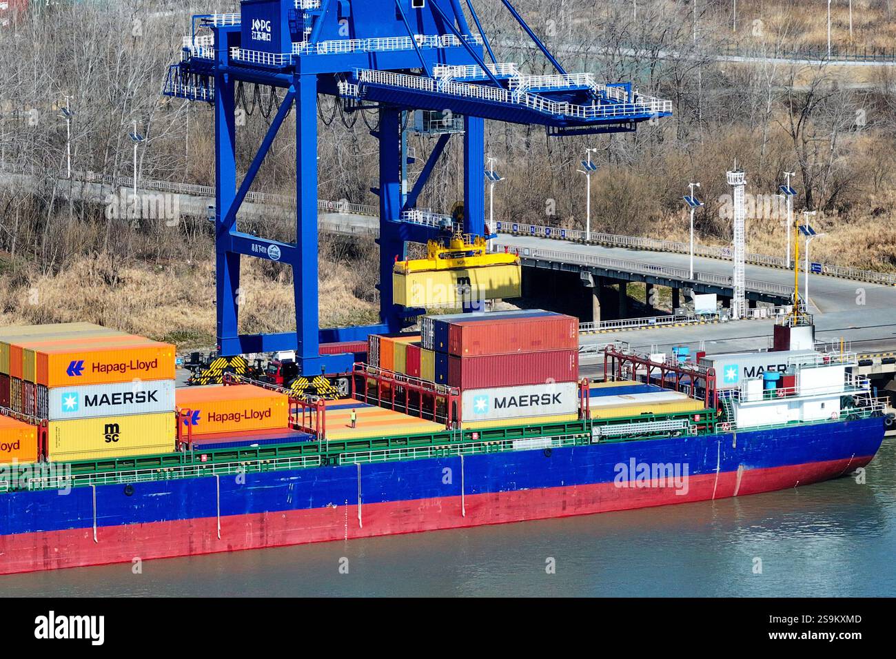 NANJING, CHINA - JANUARY 27, 2025 - Cargo ships dock at the Qiba Port ...