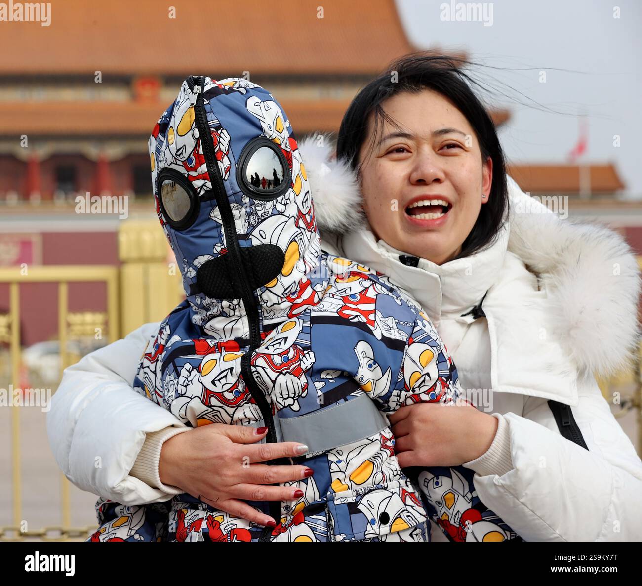 Tourists visit the Tiananmen Square amid cold air in Beijing, China, 26 ...