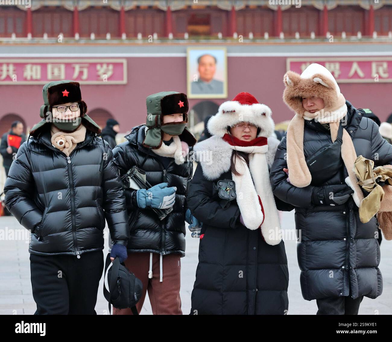 Tourists visit the Tiananmen Square amid cold air in Beijing, China, 26 ...