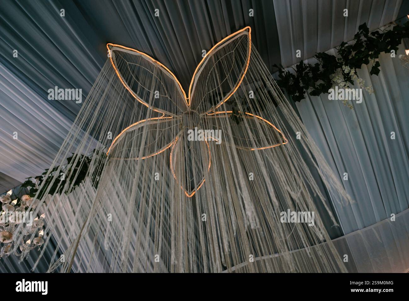 Decorative ceiling installation with white drapes and lights Stock ...