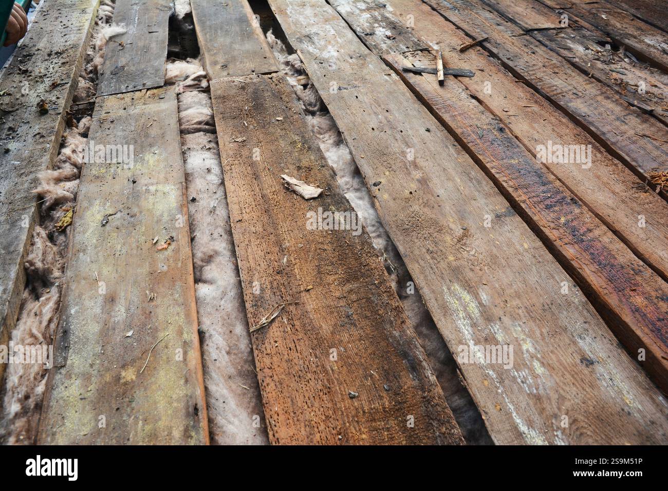 Repair of an old roof with rotten boards and wet insulation Stock Photo ...