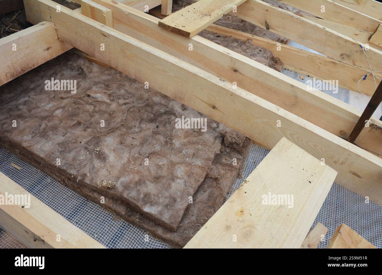 Roof insulation with basalt wool. Vapor barrier and insulation mat on a ...
