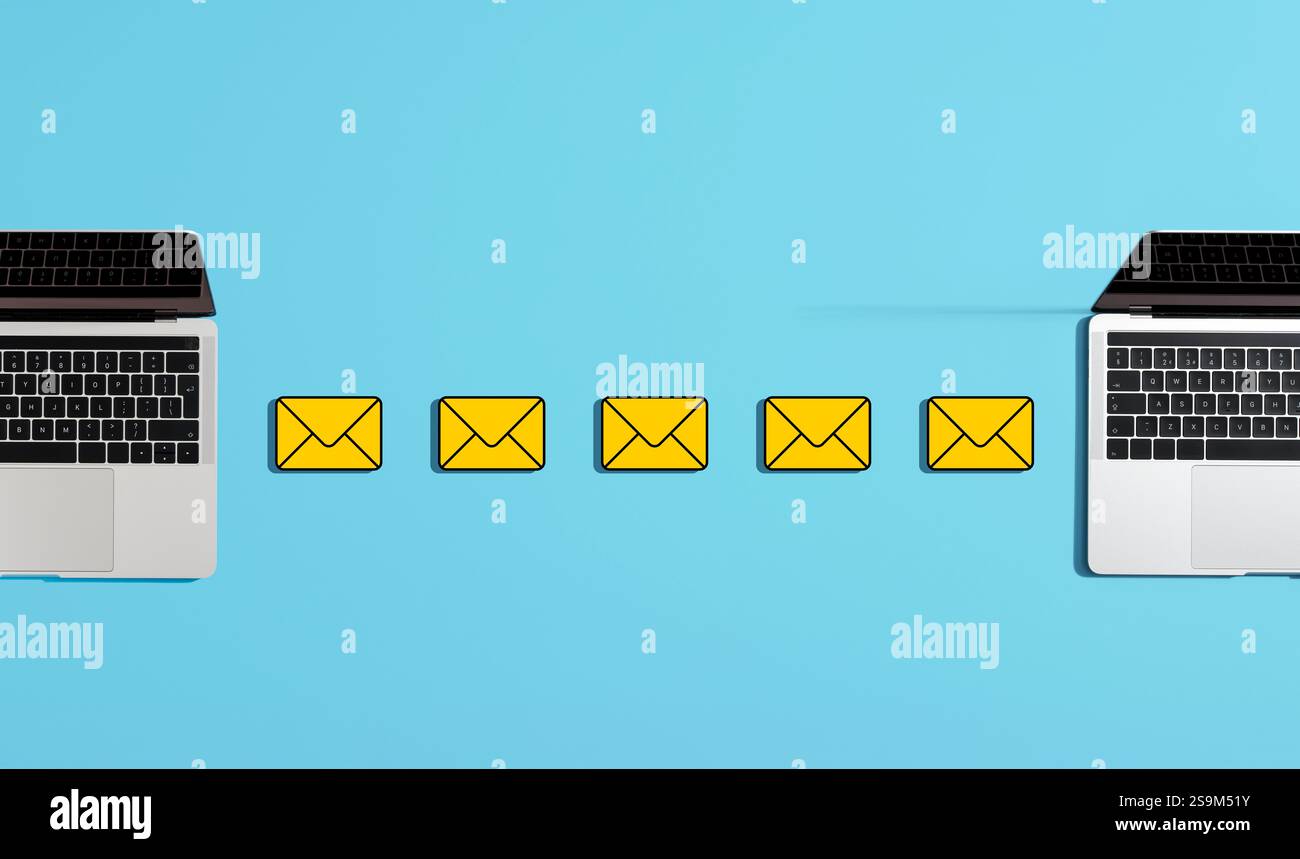 Email icons transferring seamlessly between two laptops, illustrating ...