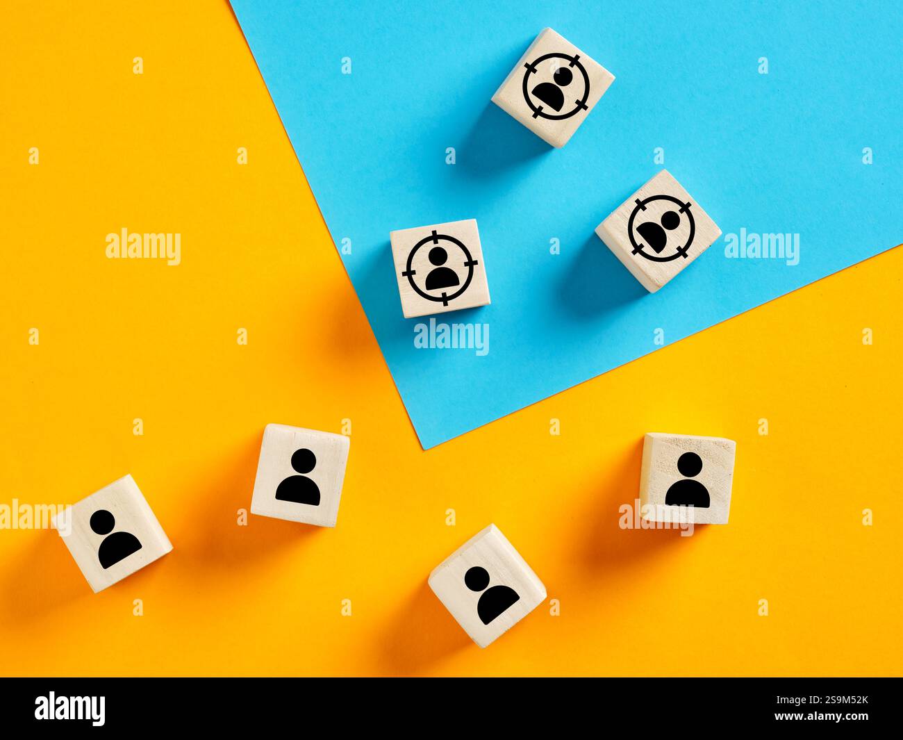 Wooden cubes representing customers with target symbols highlight ...