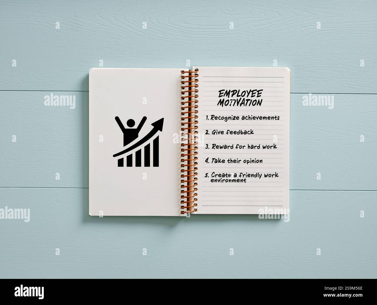 Open notebook outlining five key strategies for enhancing employee ...