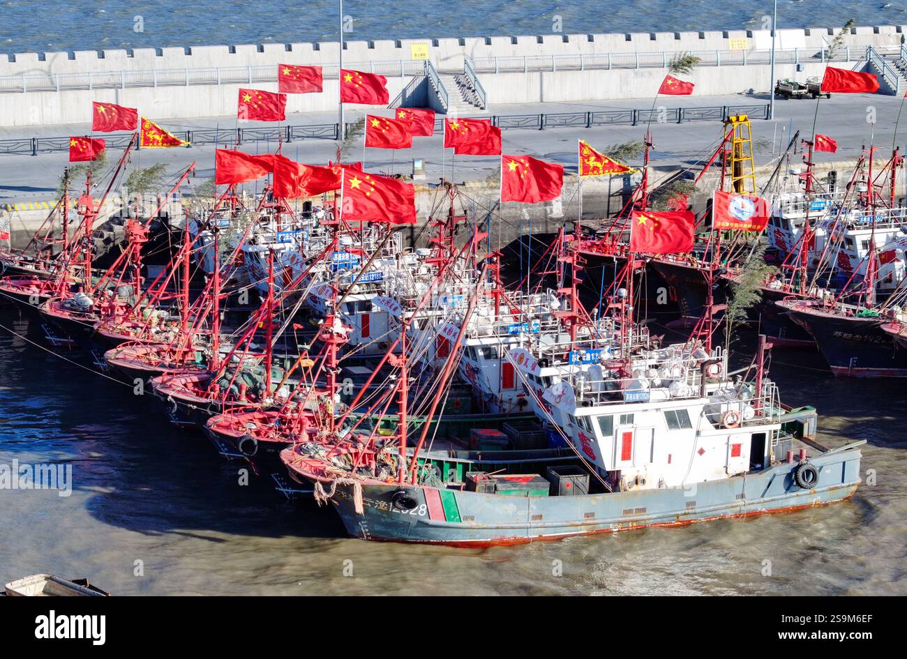 Fishermen hang national flags on their fishing boats in Lianyungang ...