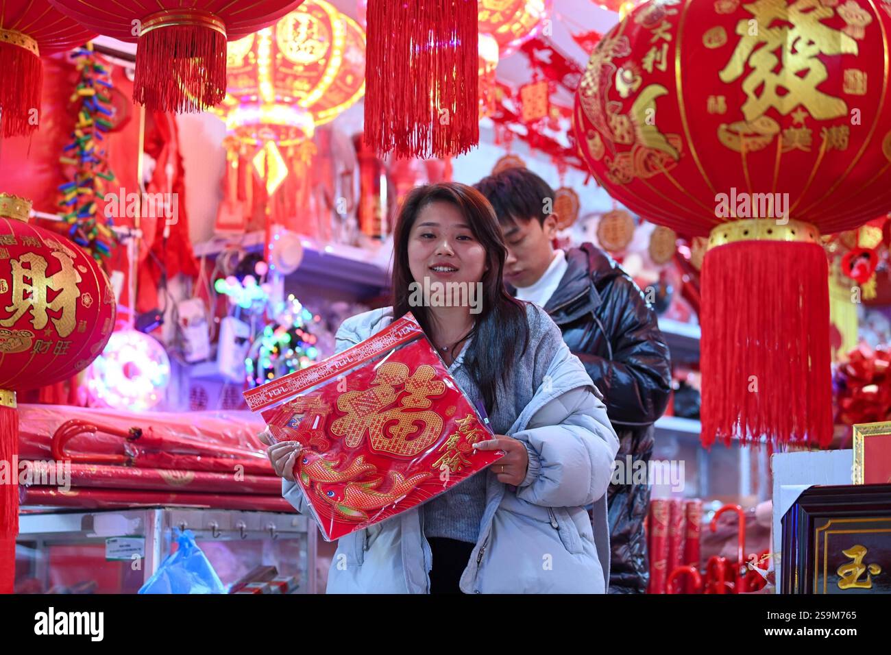 People select Spring Festival decorations at a market in Chongqing ...