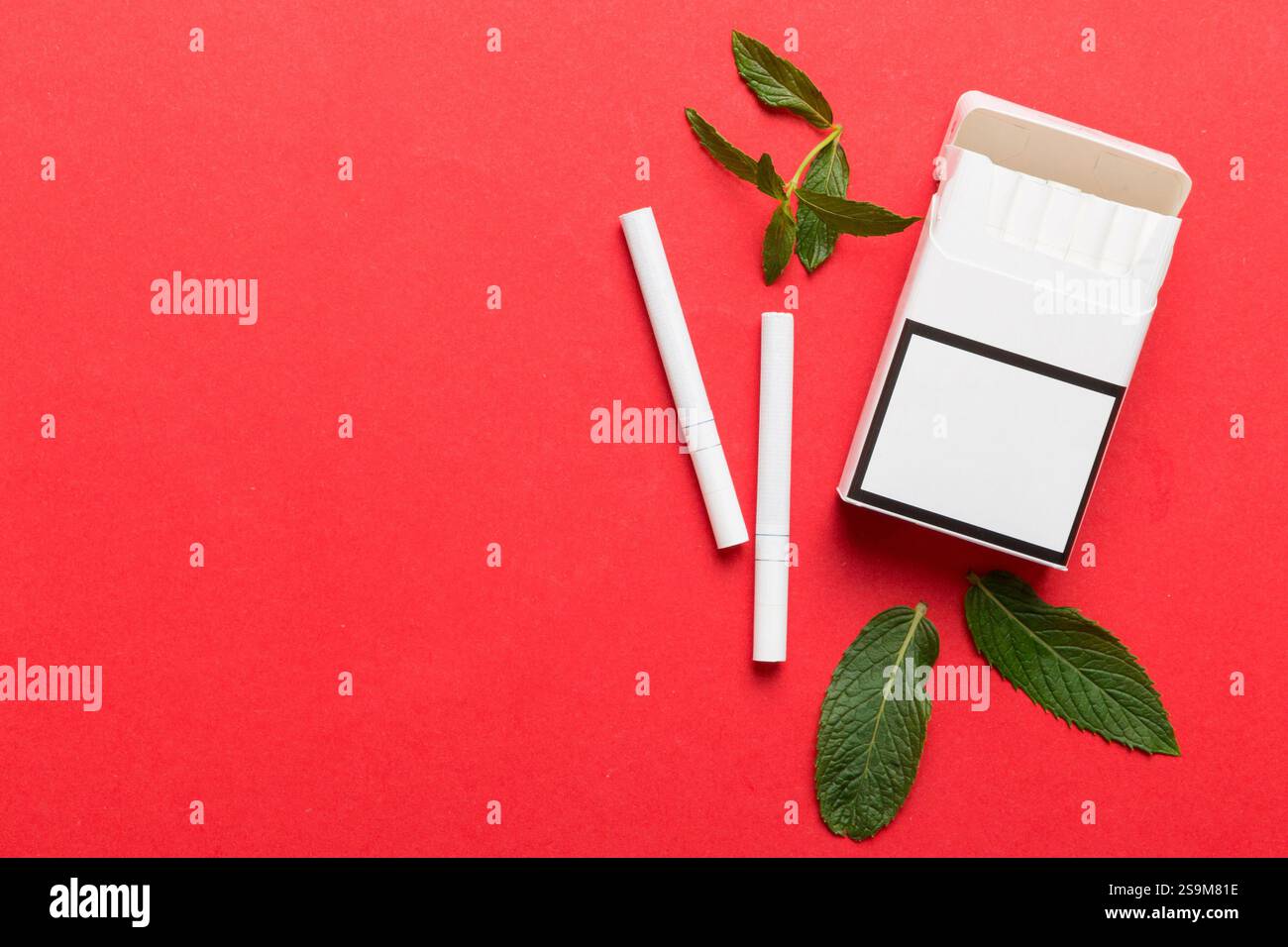 Pack of menthol cigarettes and fresh mint on colored table, Menthol ...