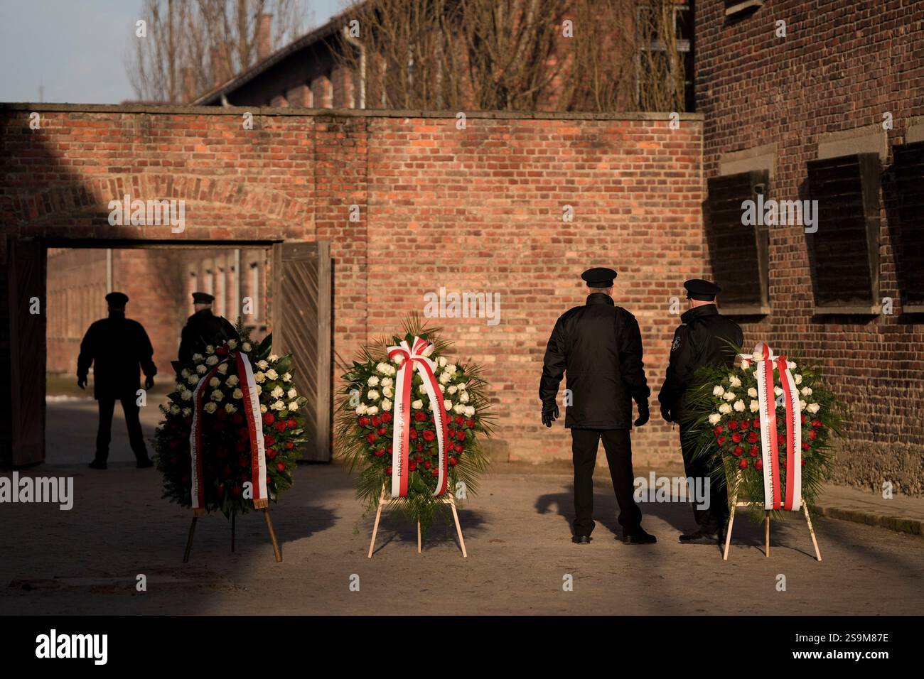 Museum guards set up wreaths at the Auschwitz-Birkenau former Nazi ...