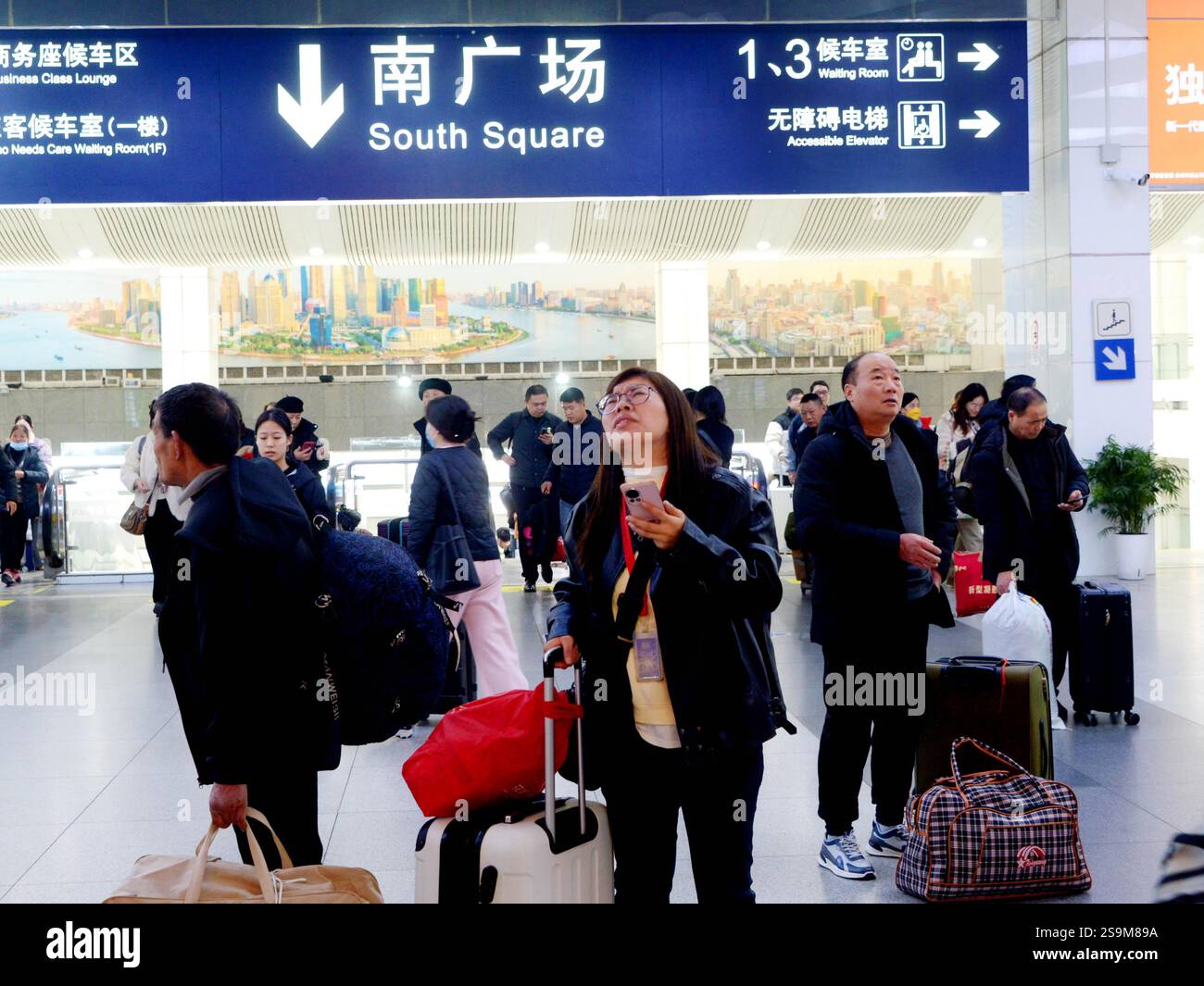 Passengers are seen at Shanghai railway station in Shanghai, China, 24 January, 2025 Stock Photo ...