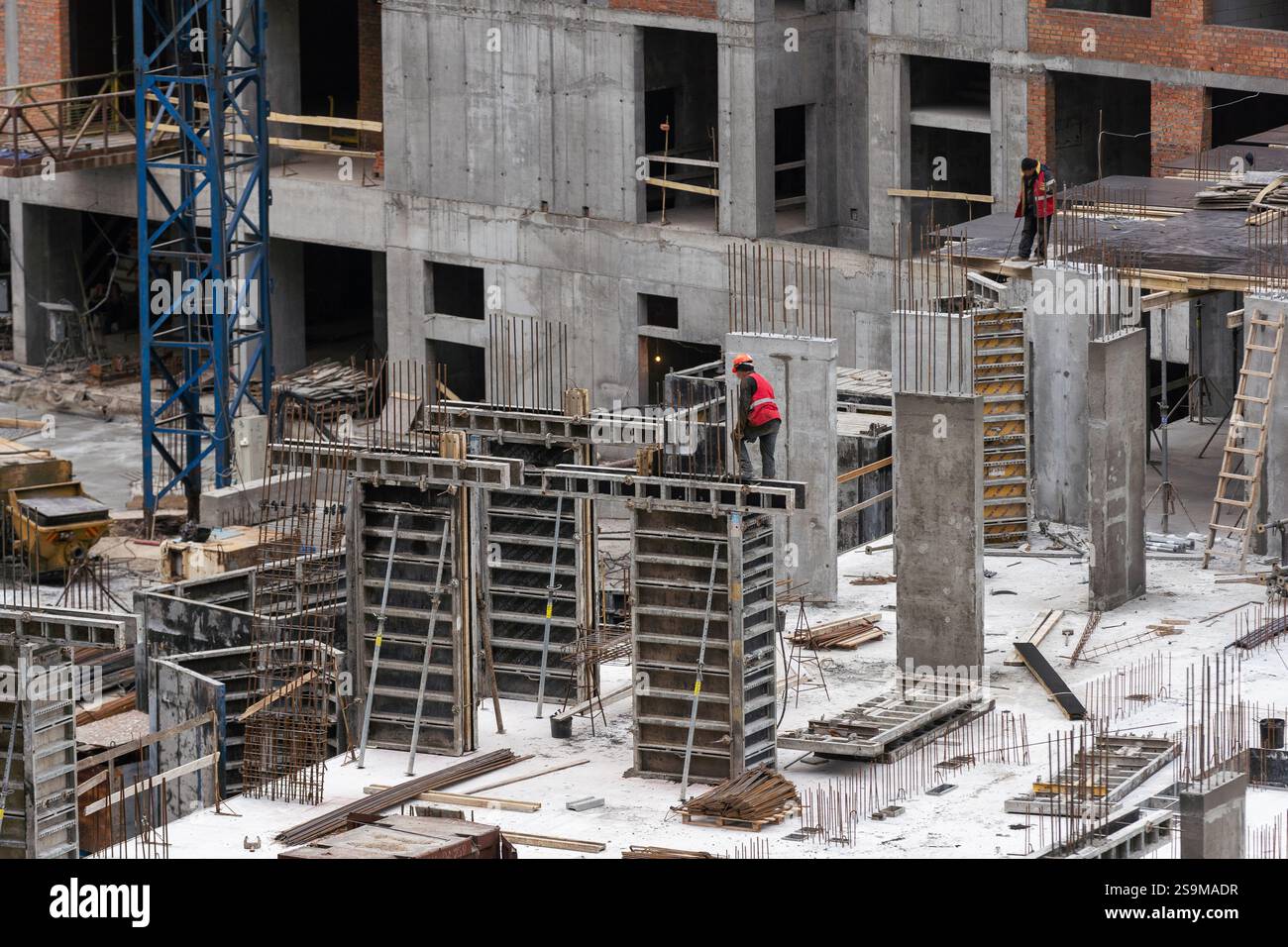 Construction workers working on Construction machine. Aerial platform ...