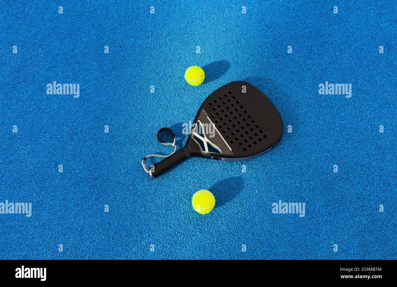 Padel tennis racket. Background with copy space. Sport court and balls ...