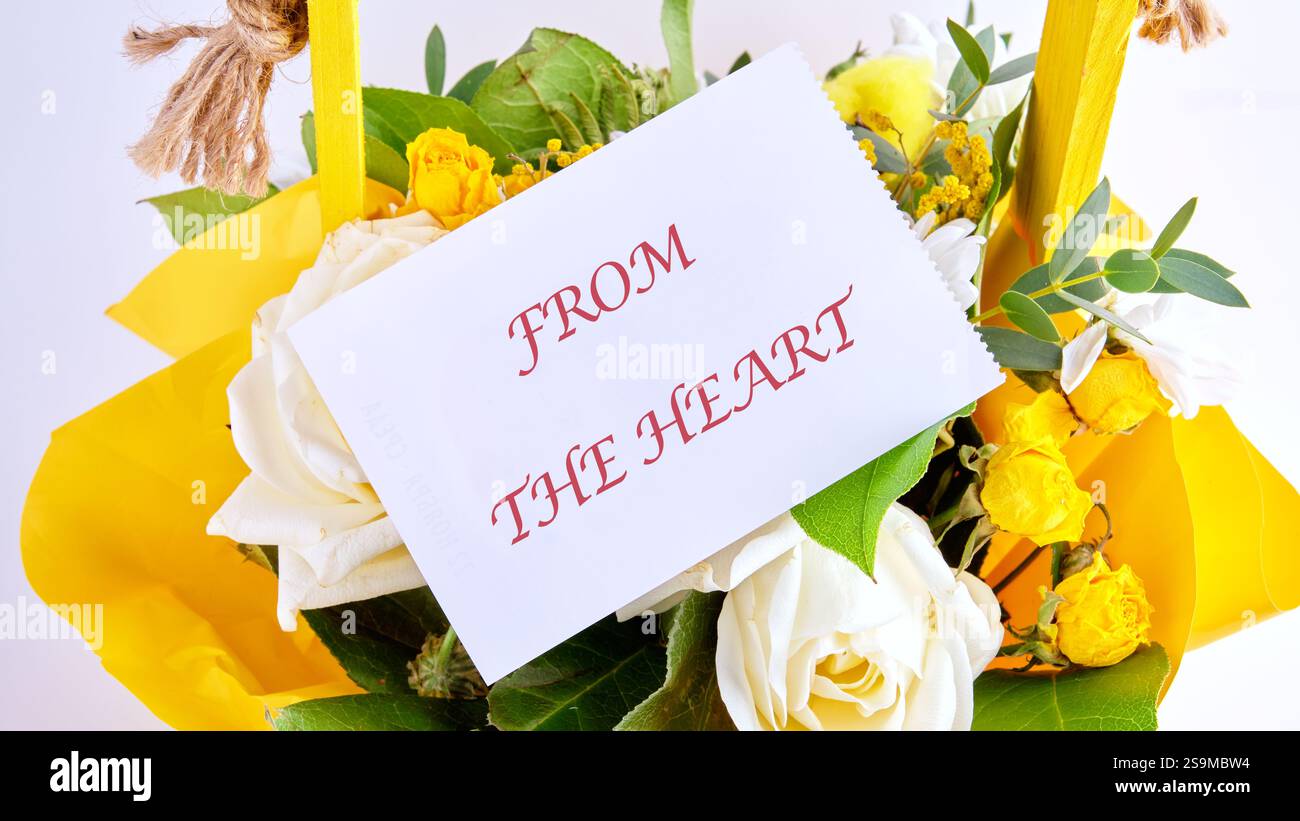 A beautiful arrangement of flowers with a heartfelt note, perfect for ...