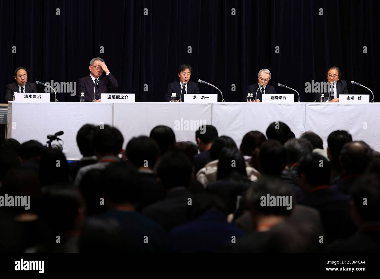 Fuji Television President Koichi Minato (C) and Chairman Shuji Kano ...