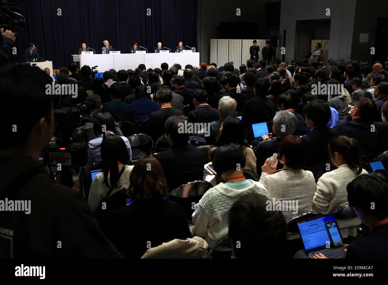 Fuji Television President Koichi Minato (C) and Chairman Shuji Kano ...