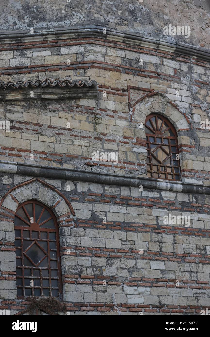 An old stone building in Albania features detailed brick patterns and ...