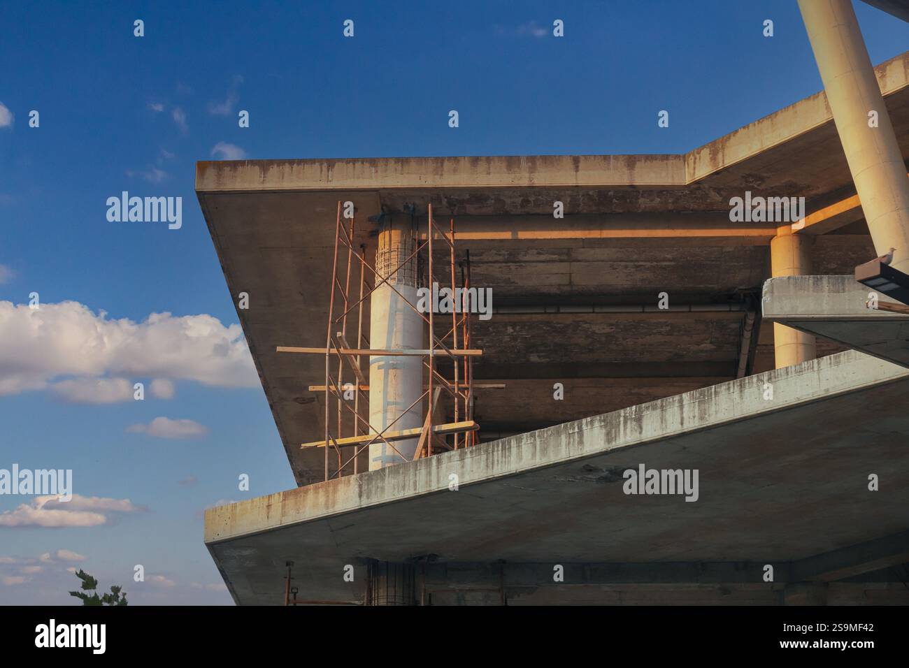 Construction workers are actively engaged in building a modern ...