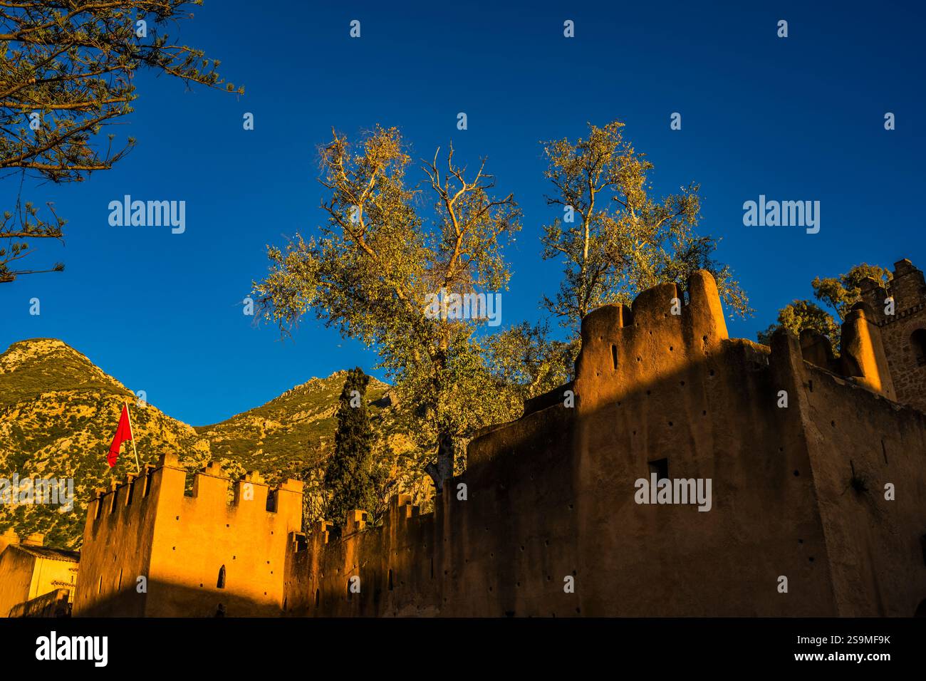 Winter sunset on the Kasbah and Moroccan flag at Chefchaouen, Morocco ...