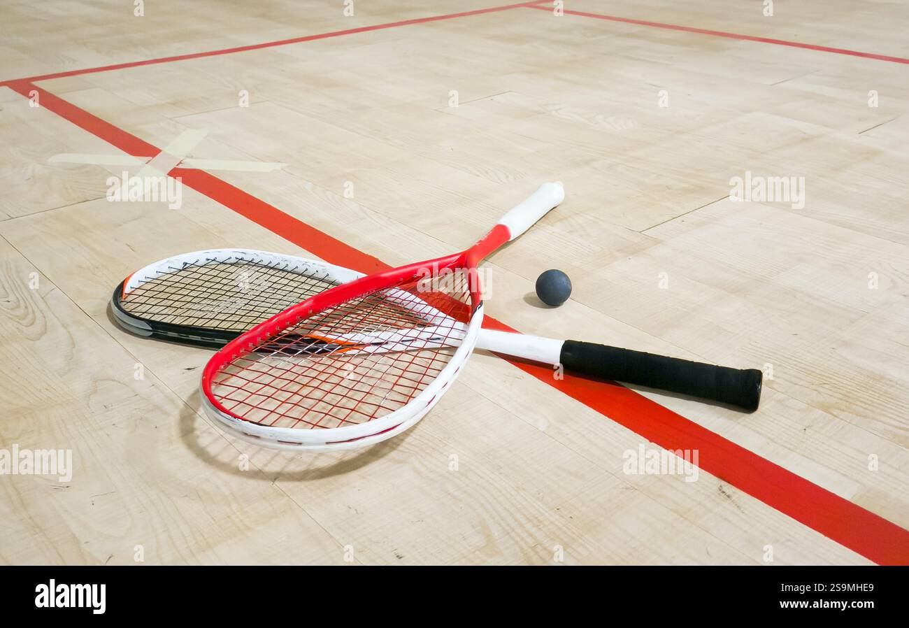 Squash rackets and ball on court floor, top view Stock Photo - Alamy