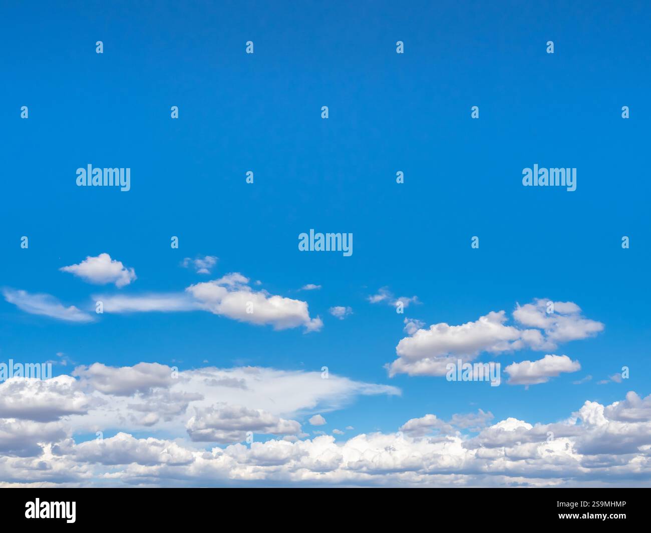 Abstract blue sky background scene with white fluffy cloud with space ...