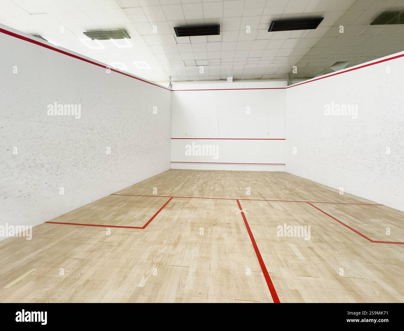 modern squash court with white walls and polished floor, motivation and ...
