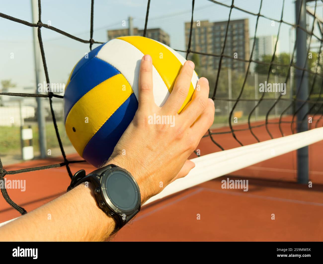 Volleyball action. Ball above net during volleyball game Stock Photo ...