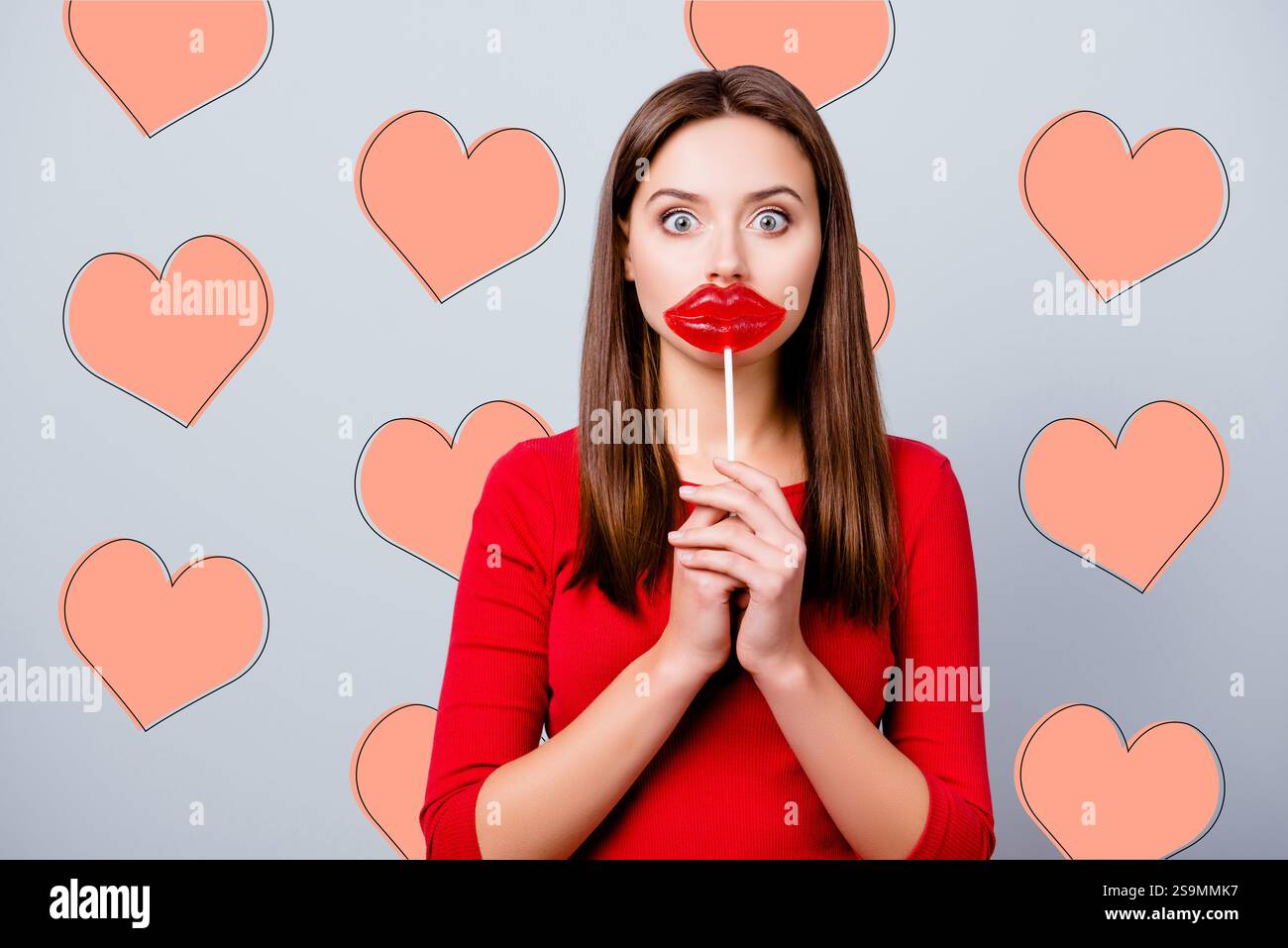 Charming, pretty, surprised brunette lady is wishing to have lips like ...