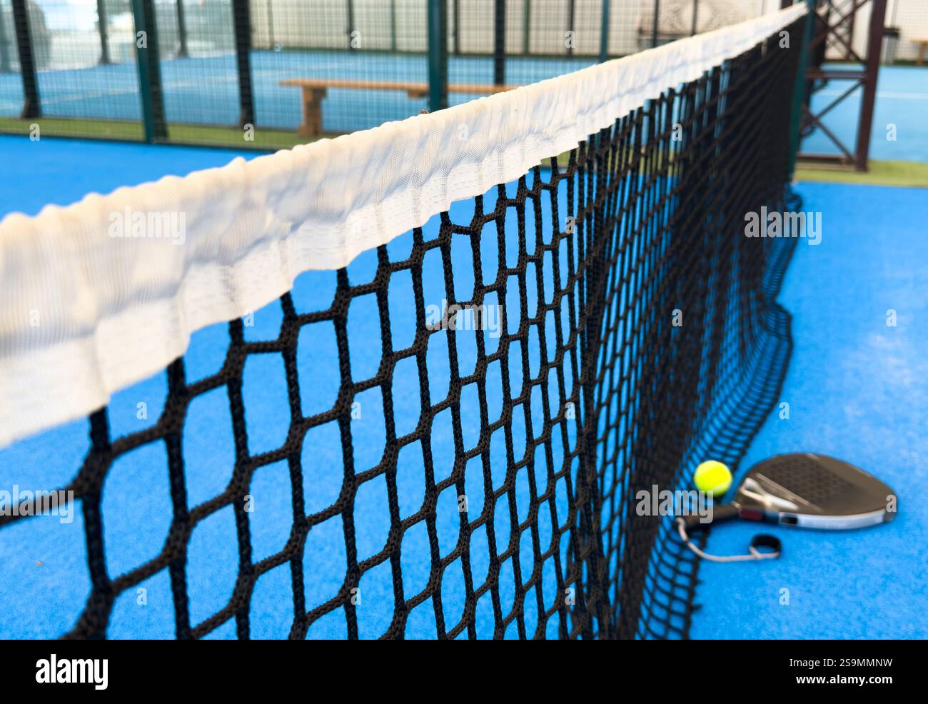 Padel tennis racket. Background with copy space. Sport court and balls ...