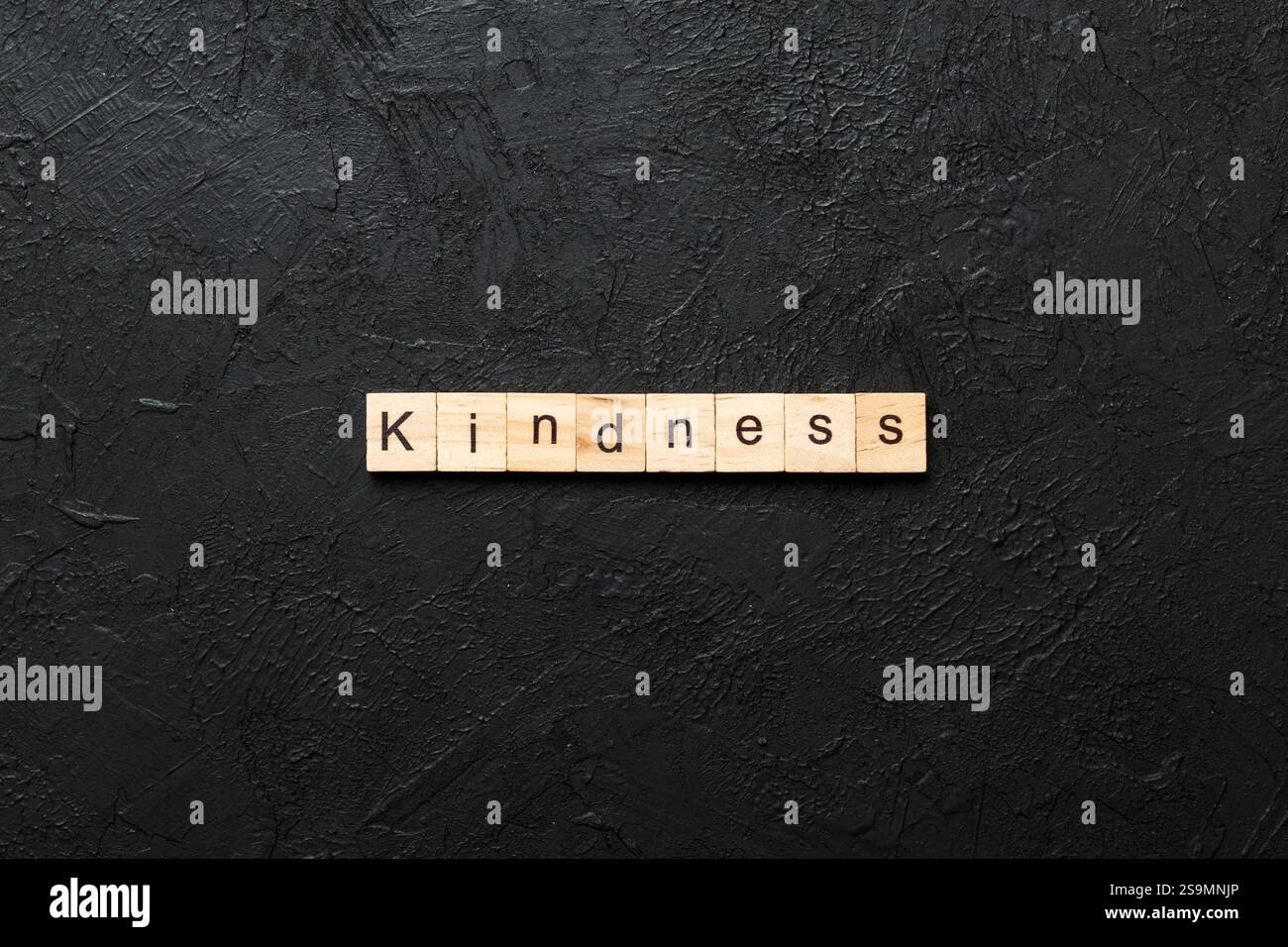 kindness word written on wood block. kindness text on table, concept ...