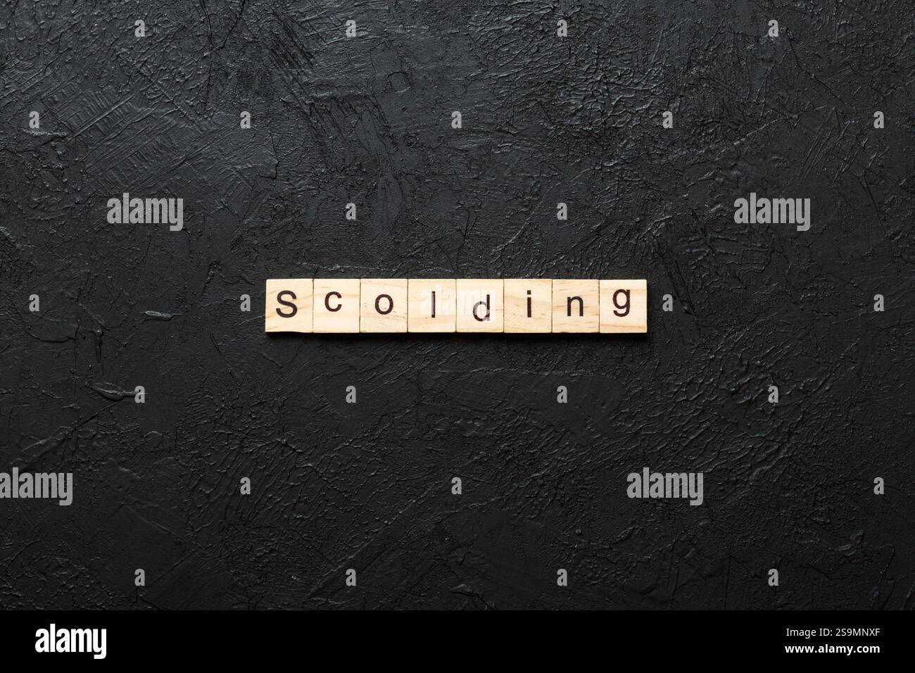 scolding word written on wood block. scolding text on table, concept ...