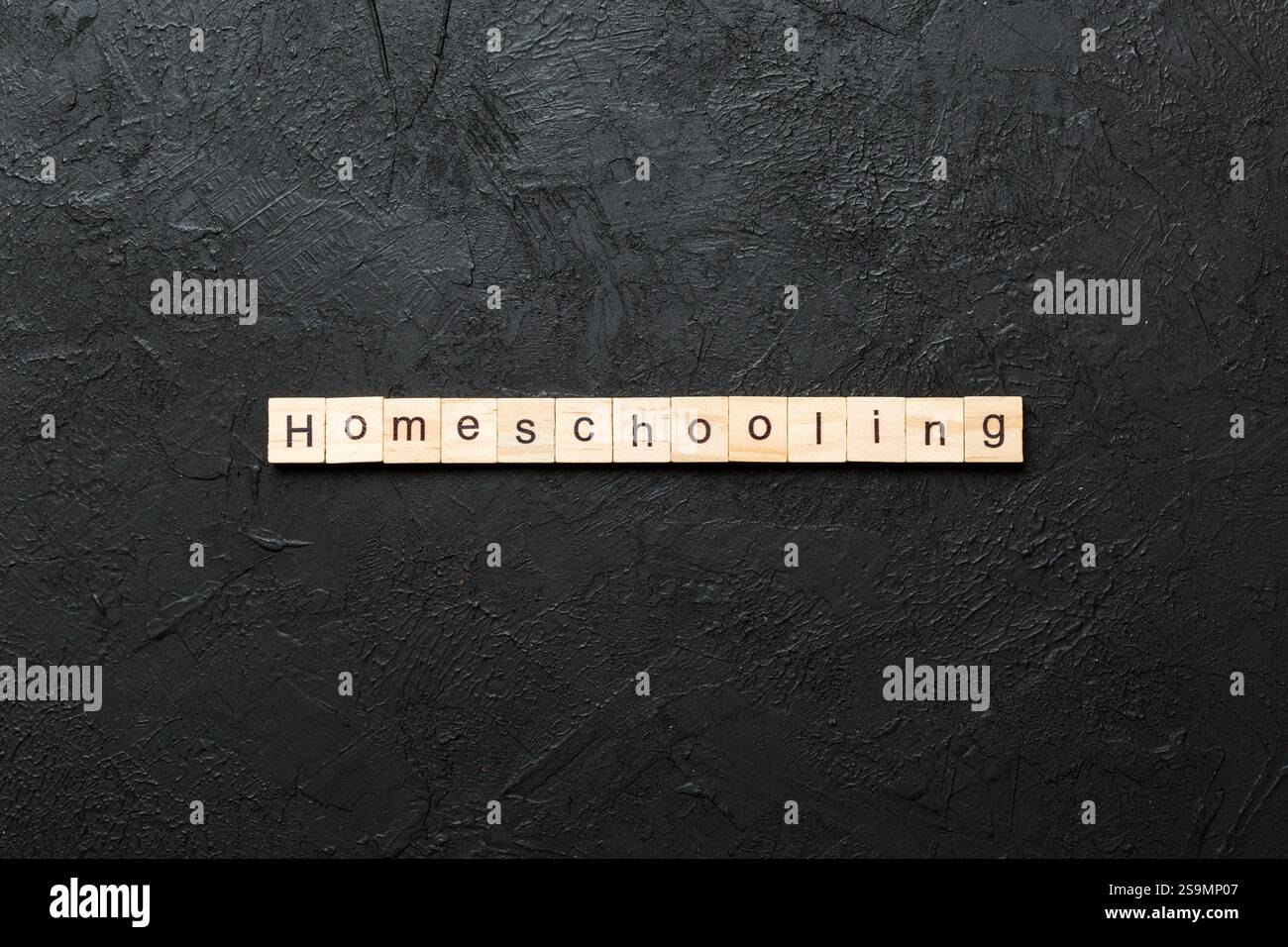 Homeschooling word written on wood block. Homeschooling text on cement ...