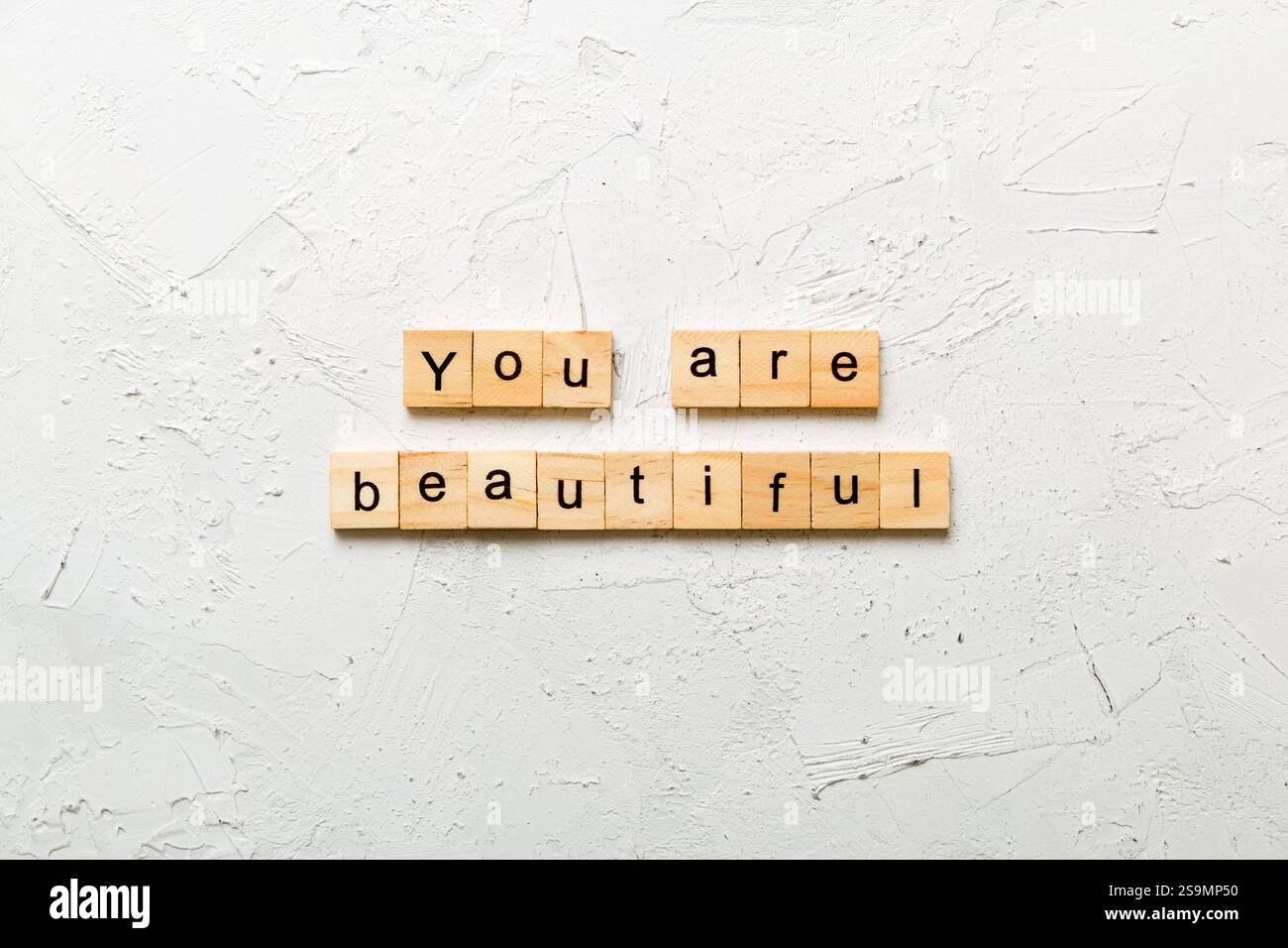 You are beautiful word written on wood block. You are beautiful text on ...