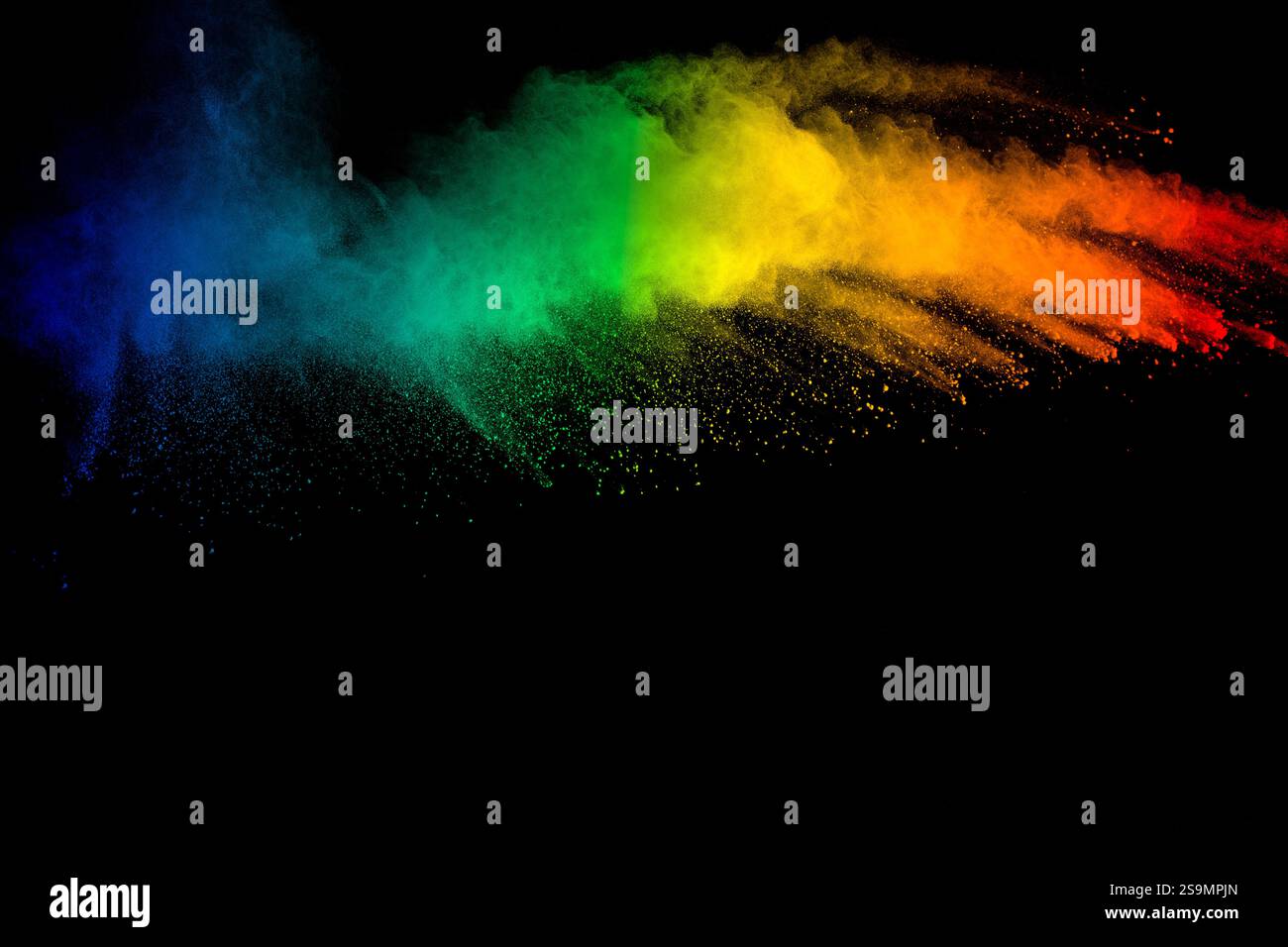 Rainbow color dust splash on black background Stock Photo - Alamy