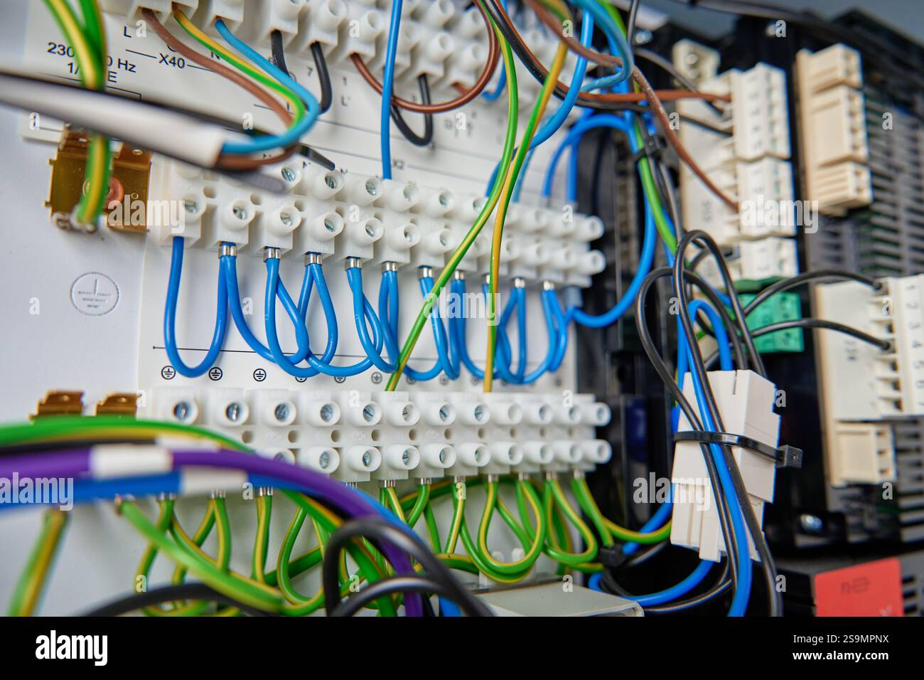 Colorful wires and components connected to terminal block in ...