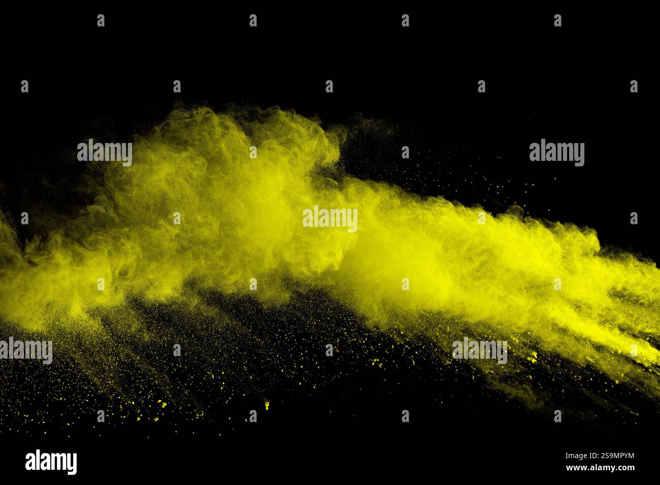 Yellow dust particles explosion on black background.Yellow powder ...