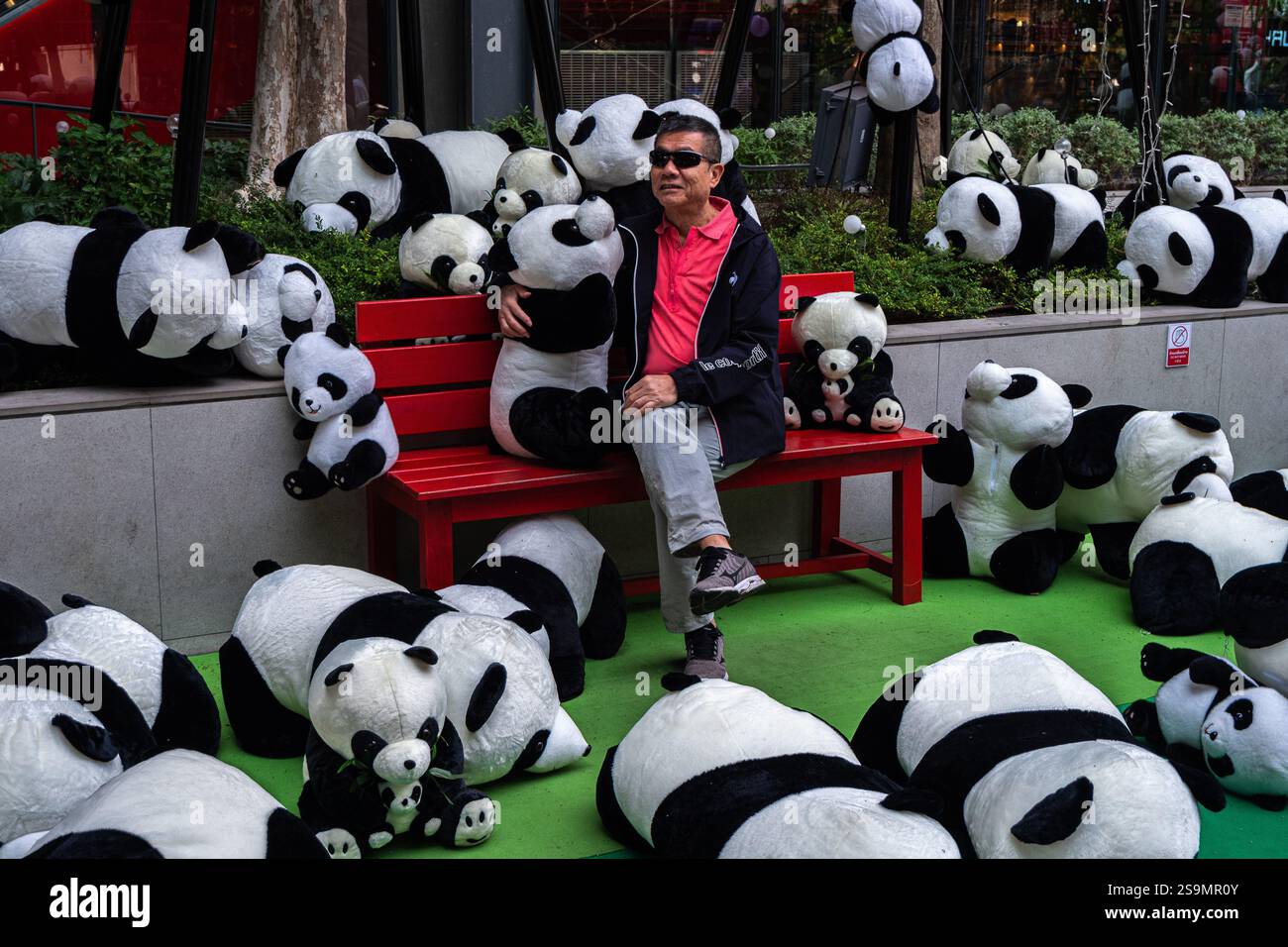 Bangkok, Thailand. 27th Jan, 2025. A man poses for a photo along with ...
