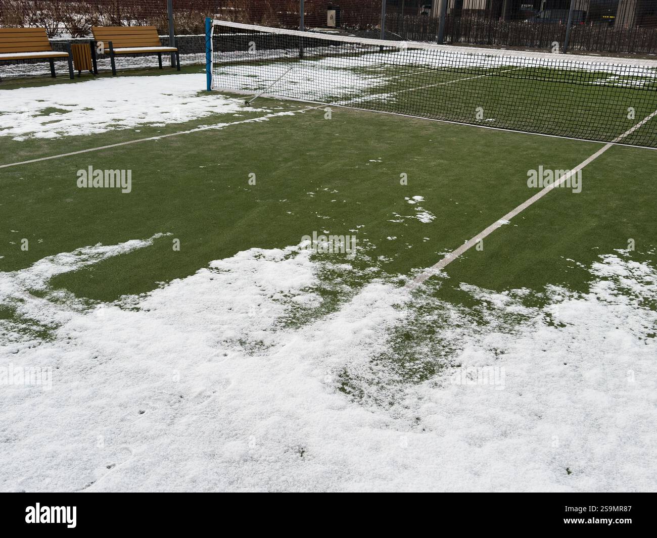 Tennis courts covered with snow in a city park in winter Stock Photo ...