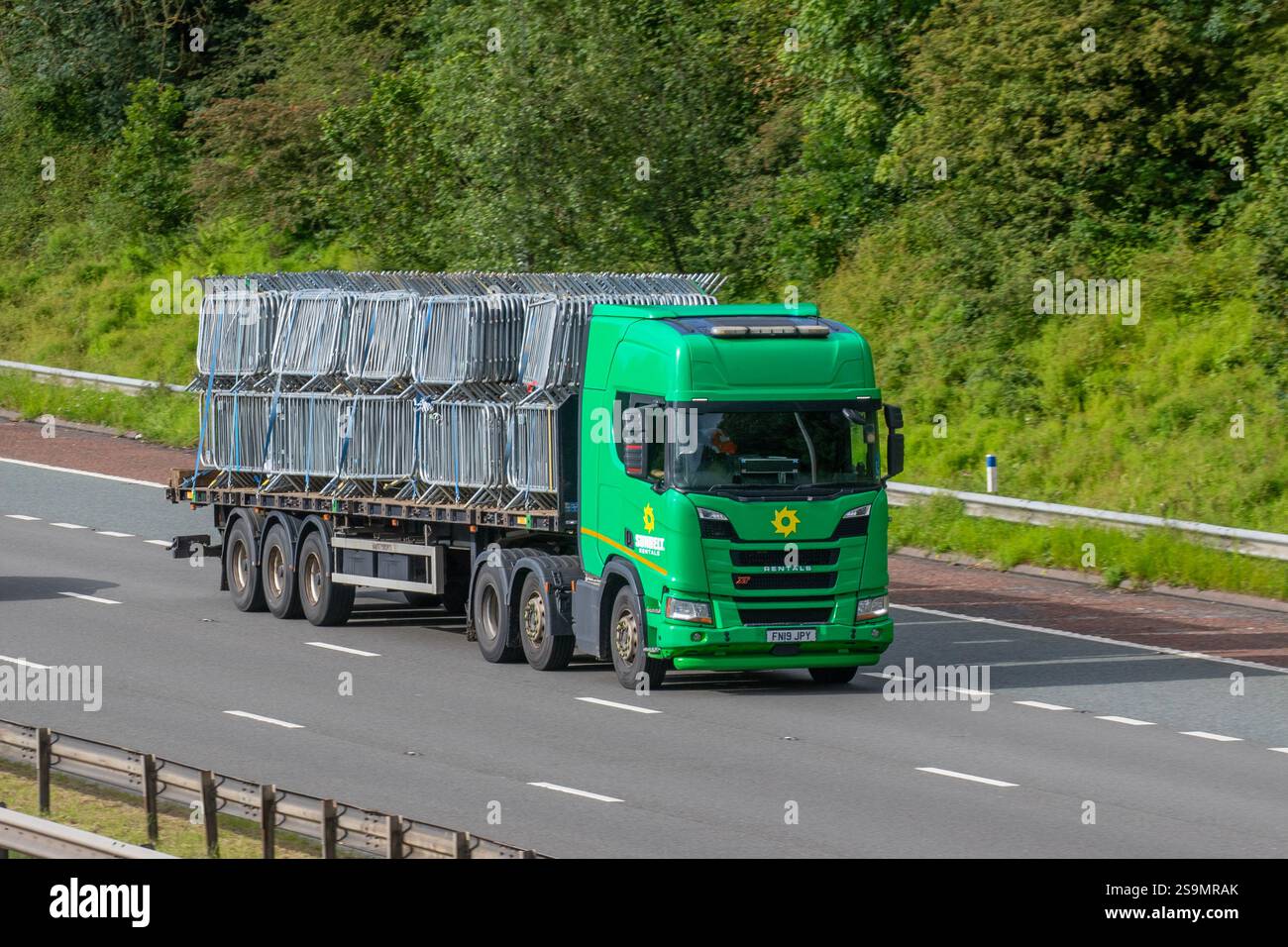 Sunbelt rentals HGV flatbed lorry transporting crowd control event ...